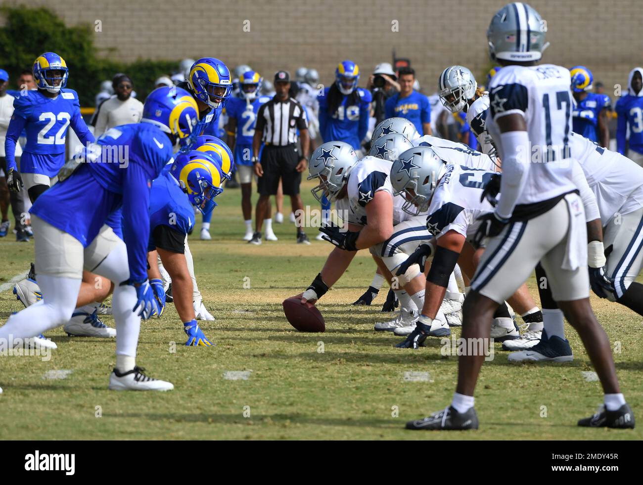 The Los Angeles Rams line up against the Dallas Cowboys during a joint ...