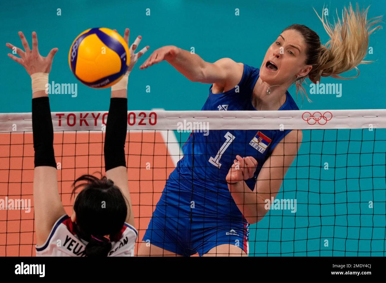 Serbia's Bianka Busa spikes the ball as Korea's Yeum Hye Seon defends ...