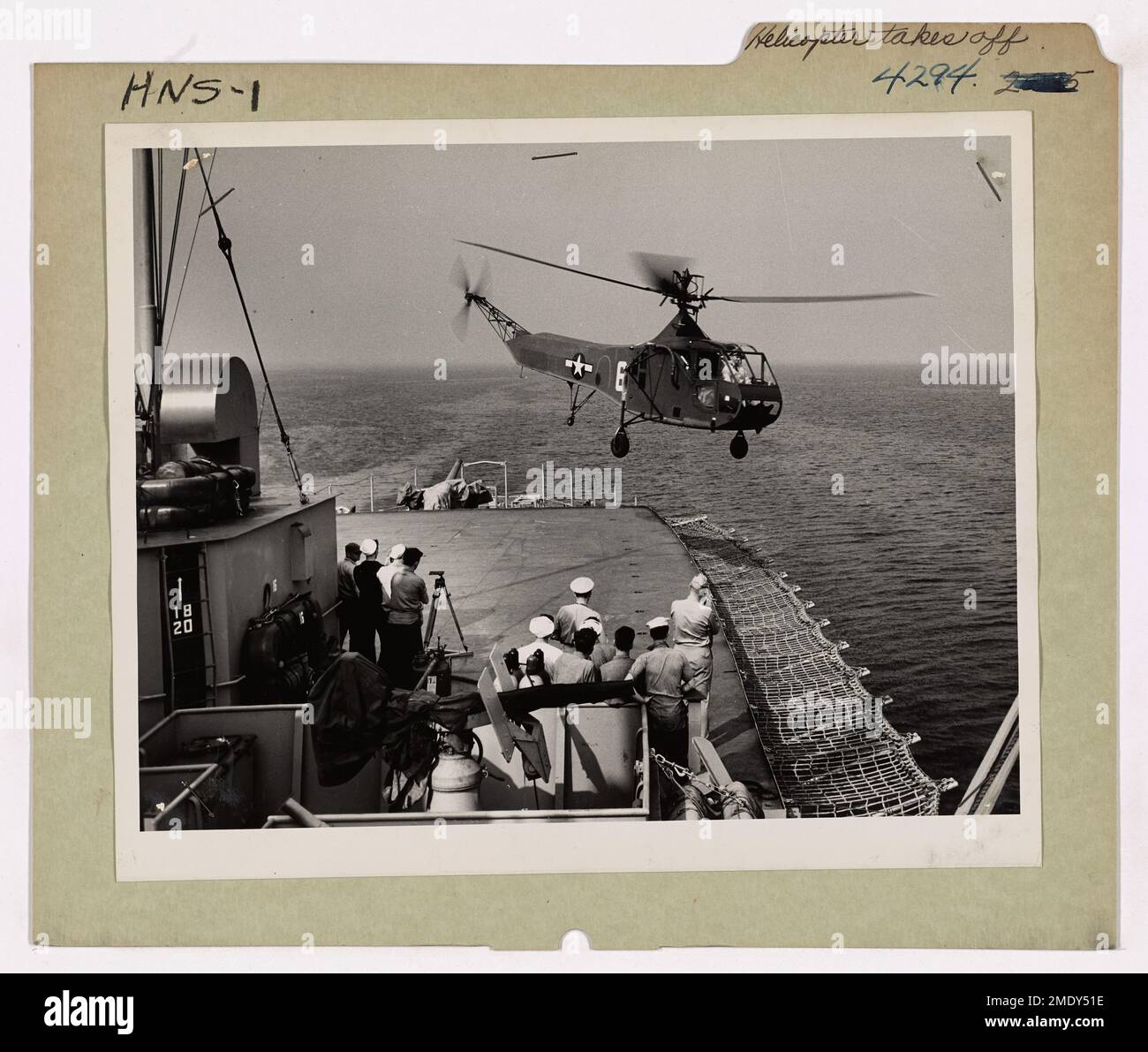 A Sikorsky helicopter takes off from a Coast Guard cutter for a ...