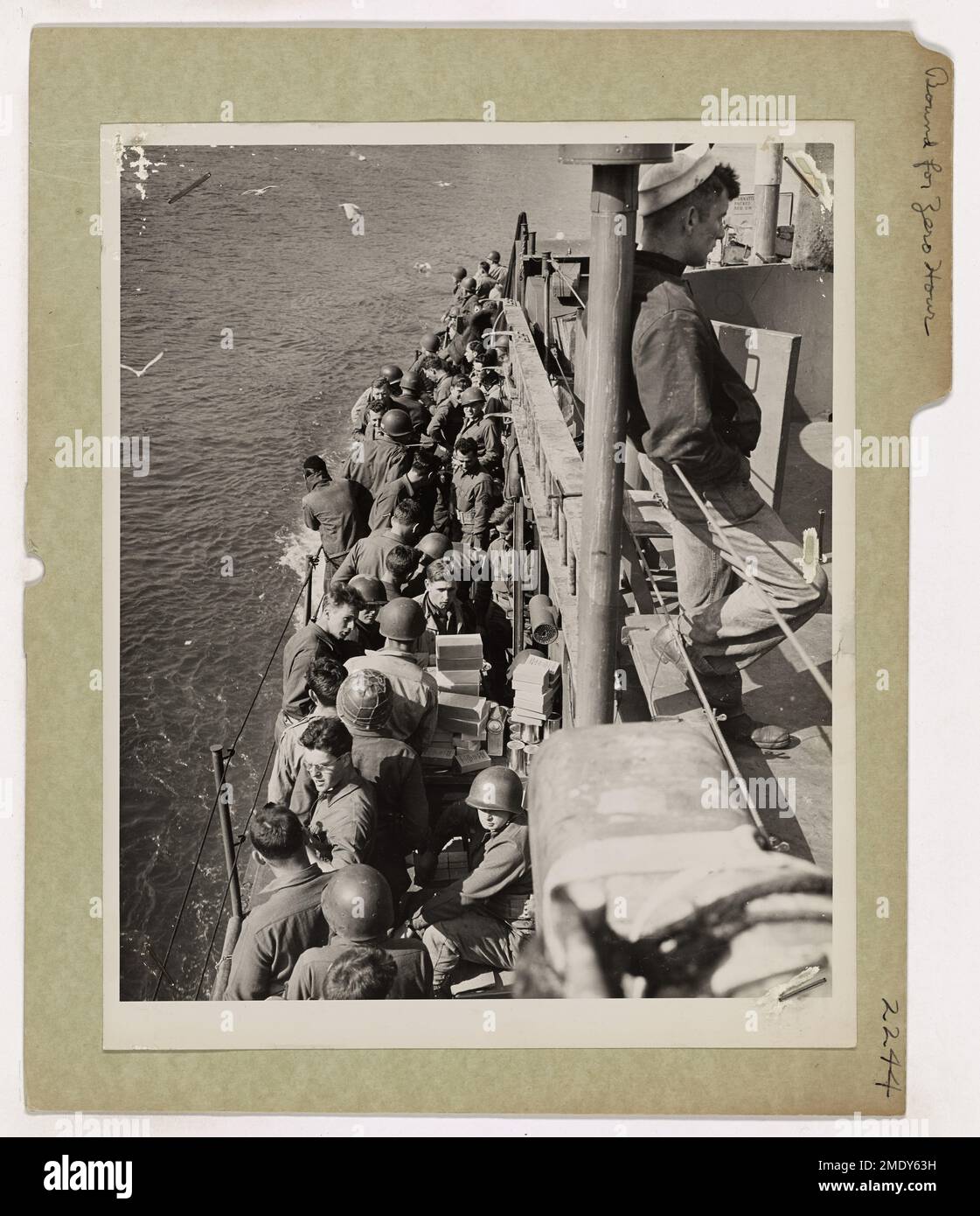 This image shows American troops aboard a Coast Guard-manned assault ...