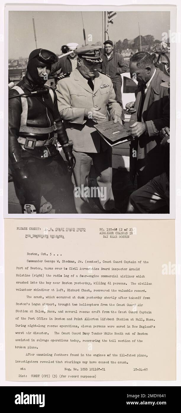 This image shows Coast Guard Commander George W. Stedman, Jr. assisting ...