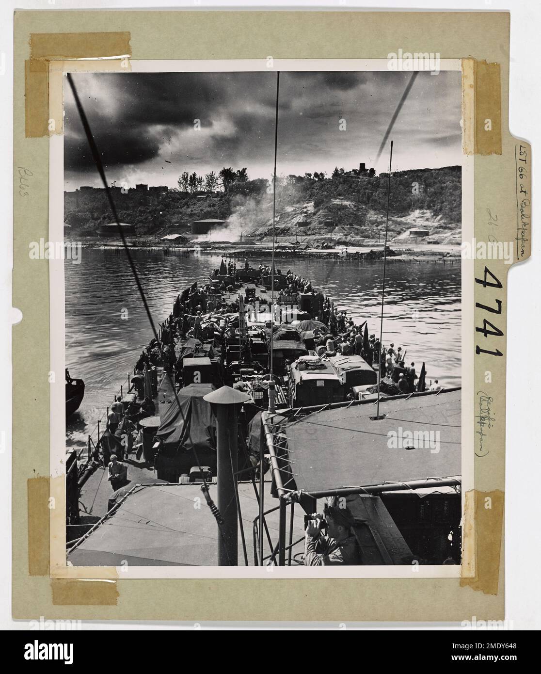 The image shows the LST 66, a landing ship tank, operating at ...