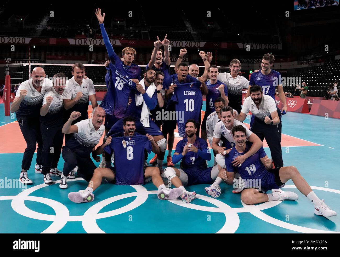 Team France poses for a group photo after winning the men's volleyball ...