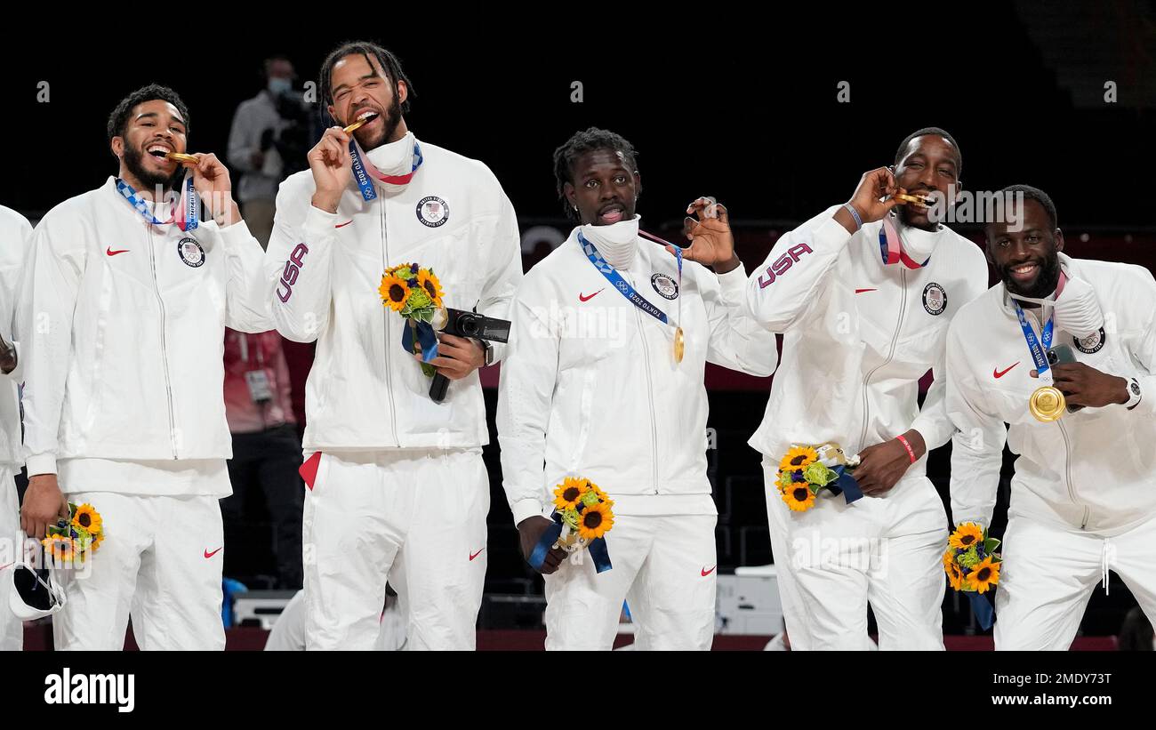United States basketball players celebrate their gold medals on the ...