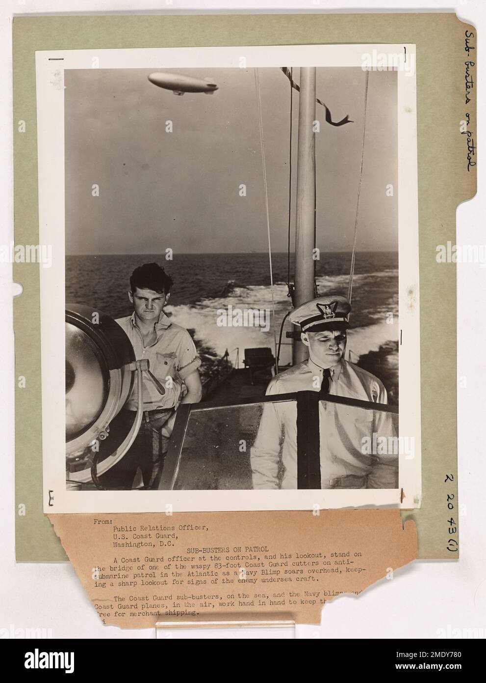 A Coast Guard officer and lookout are on anti-submarine patrol aboard a ...