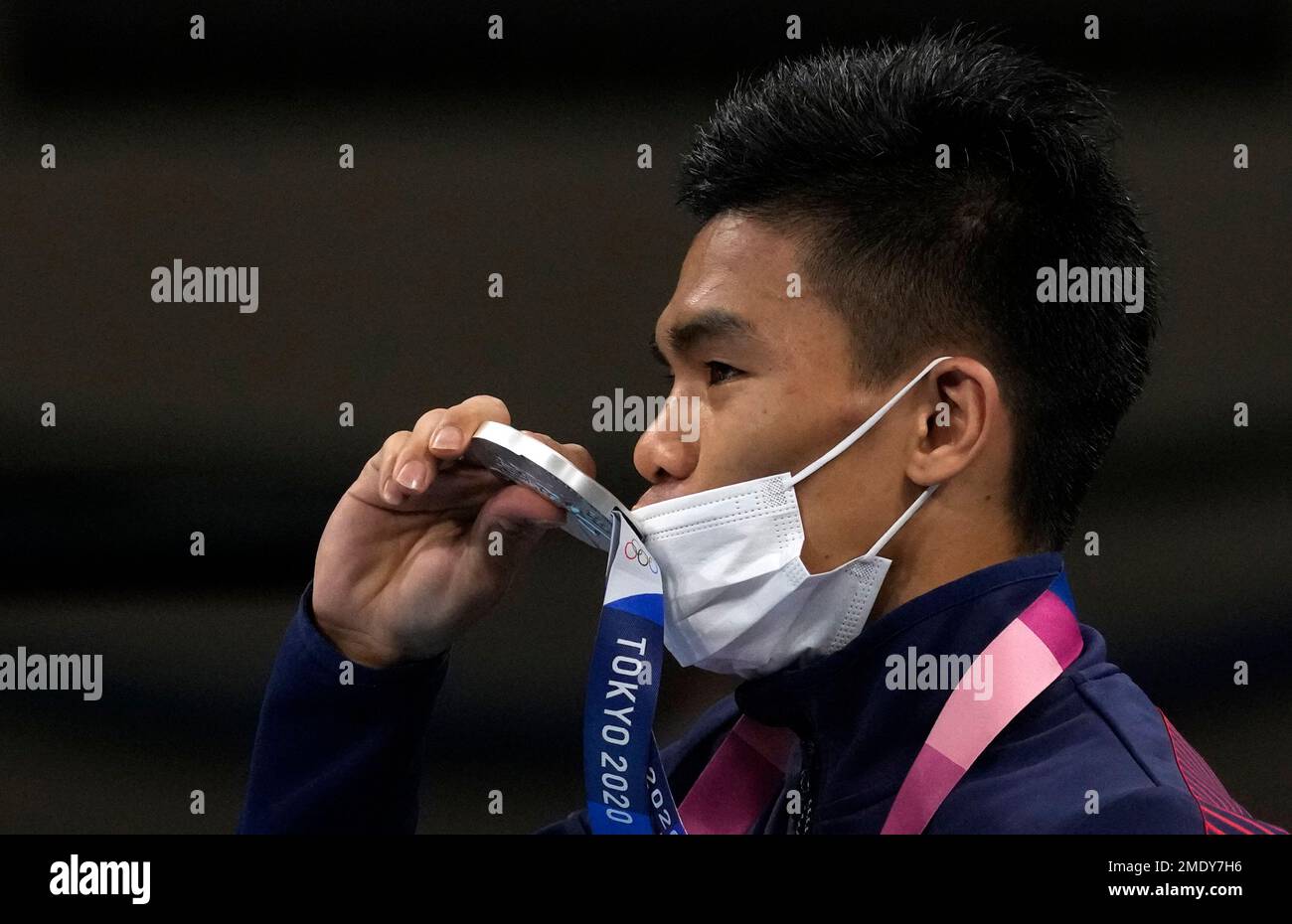 Silver medal winner Carlo Paalam, of the Philippines, kisses his medal ...