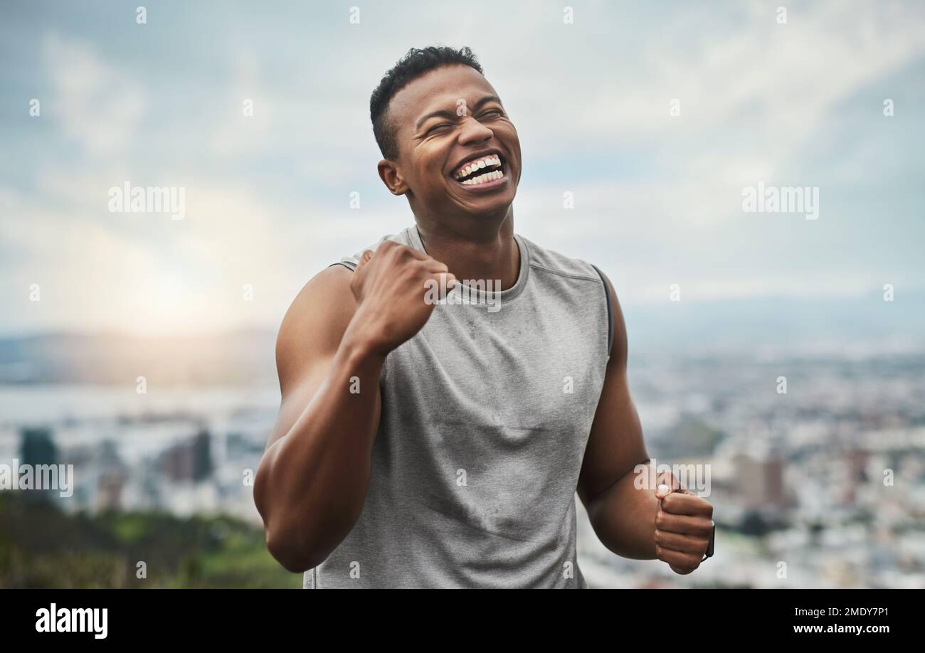 Hes impressed with himself. a handsome young sportsman cheering in ...