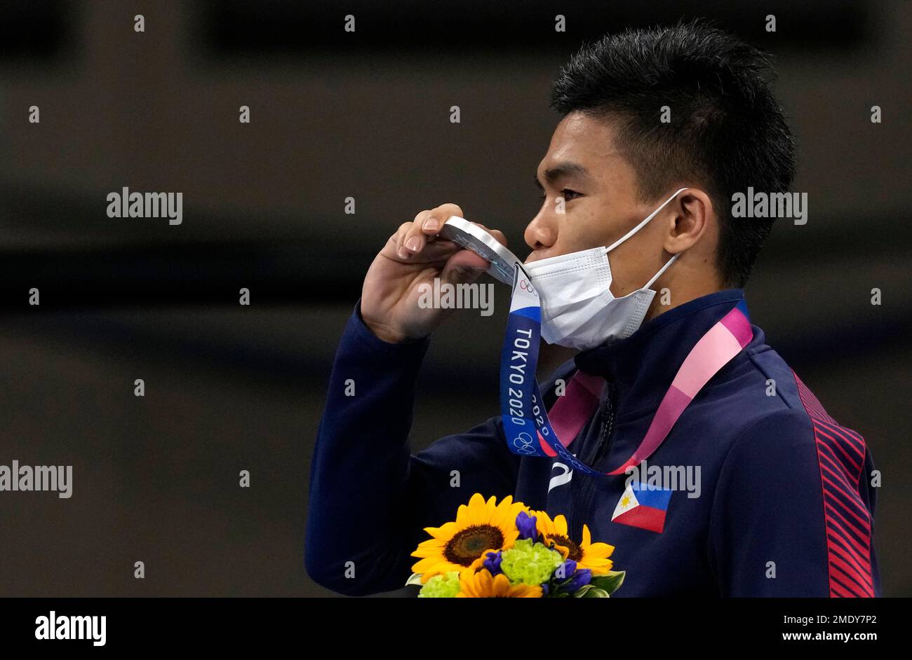 Silver medal winner Carlo Paalam, of the Philippines, kisses his medal ...