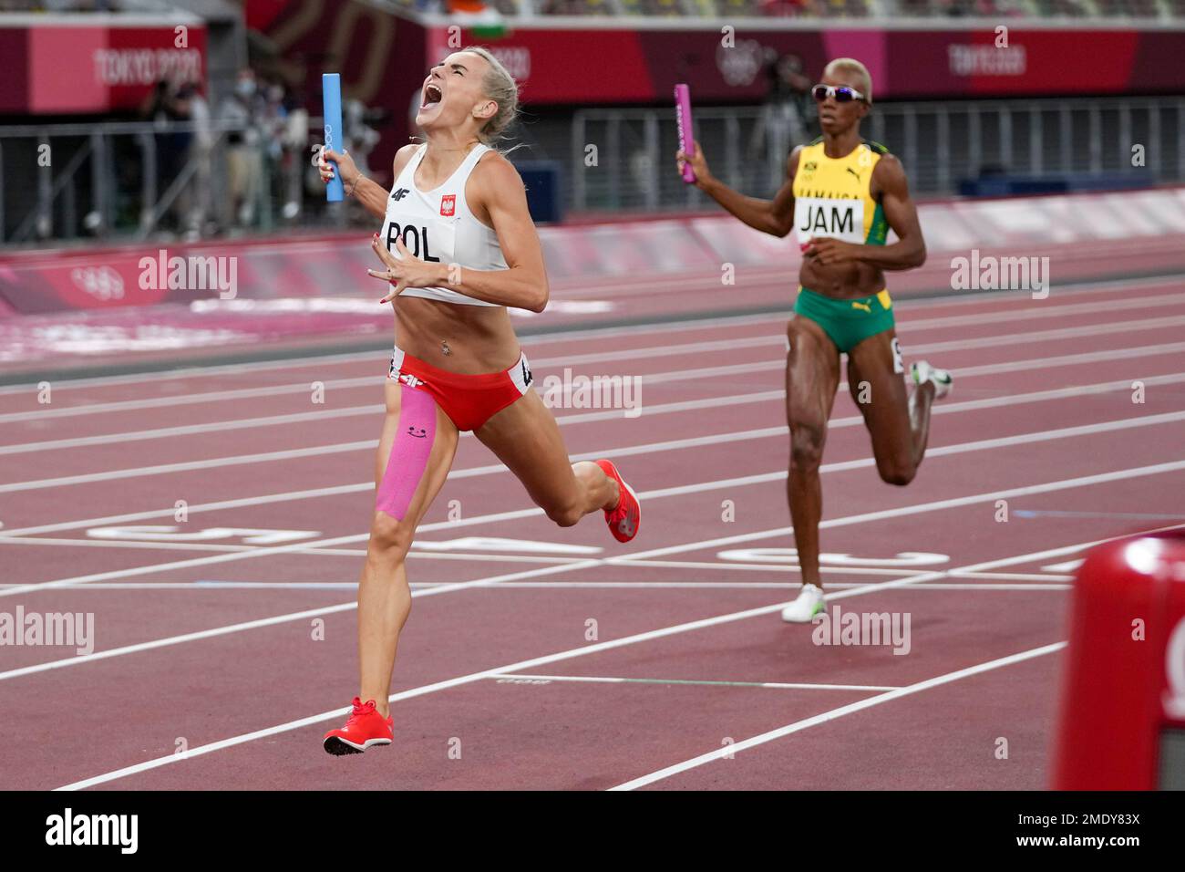 Justyna Swiety-Ersetic, of Poland, celebrates after winning the silver ...