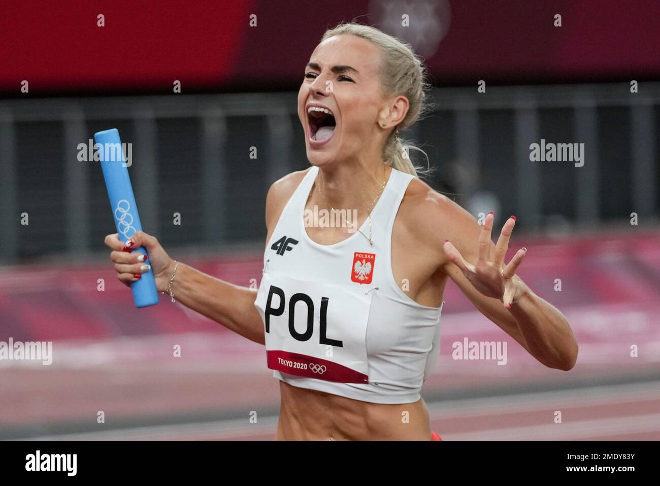 Justyna Swiety-Ersetic, of Poland, celebrates after winning the silver ...