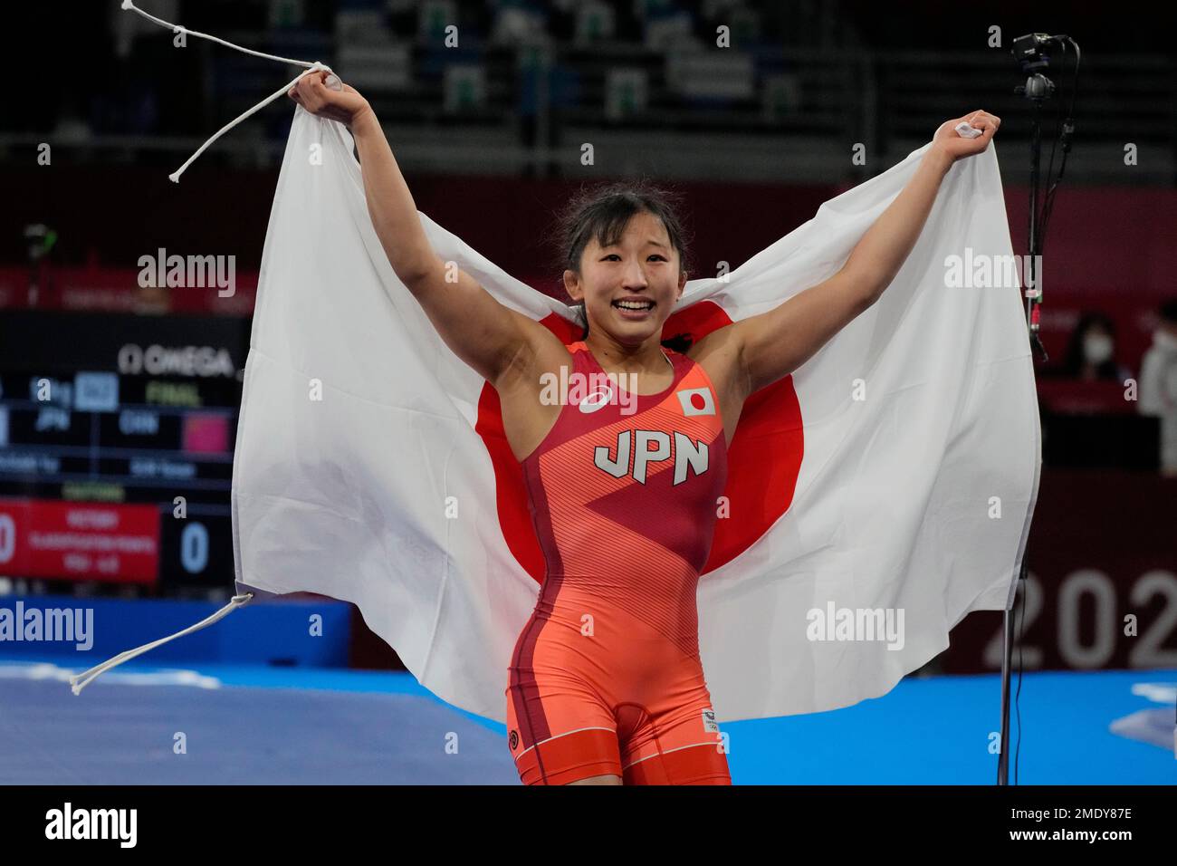 Japan's Yui Susaki celebrates after defeating China's Sun Yanan during ...