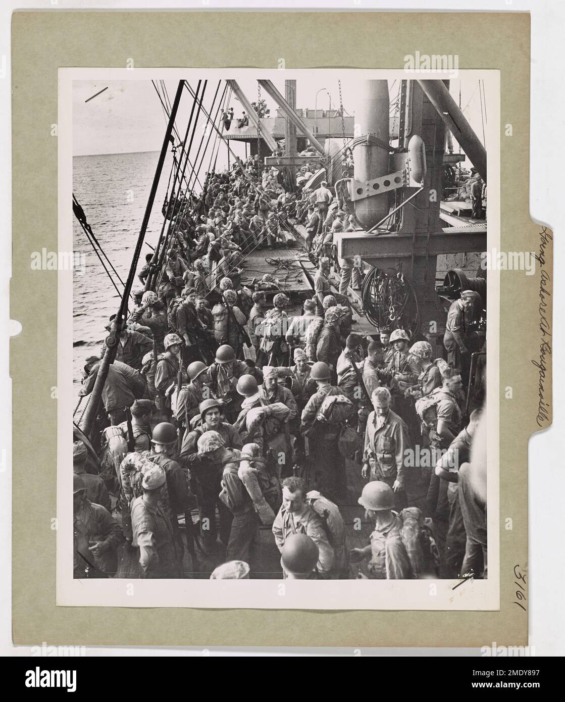 Going Ashore at Bougainville. Crowding the deck of a Coast Guard Manned ...