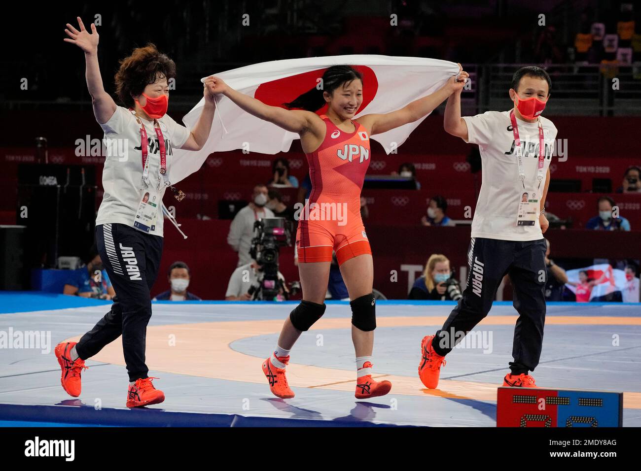 Japan's Yui Susaki, center, celebrates with team members after ...