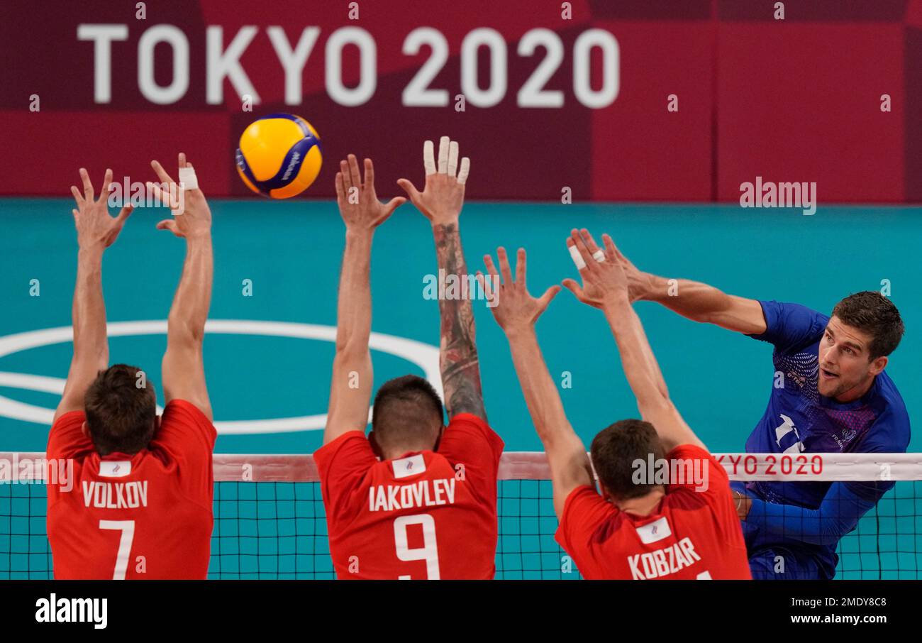 France's Trevor Clevenot spikes a ball during the men's volleyball gold ...