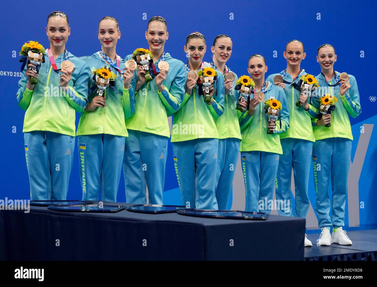Ukraine's team celebrate their bronze medals after artistic swimming ...
