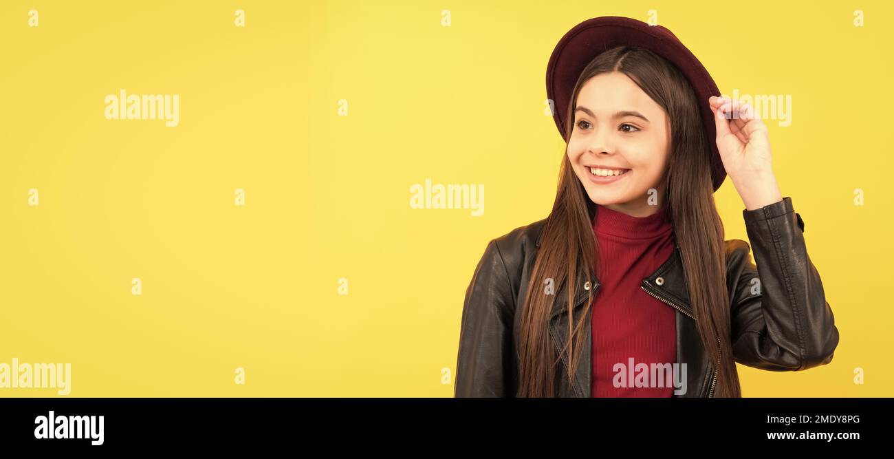 happy teen girl in hat and leather jacket, style. Child face ...