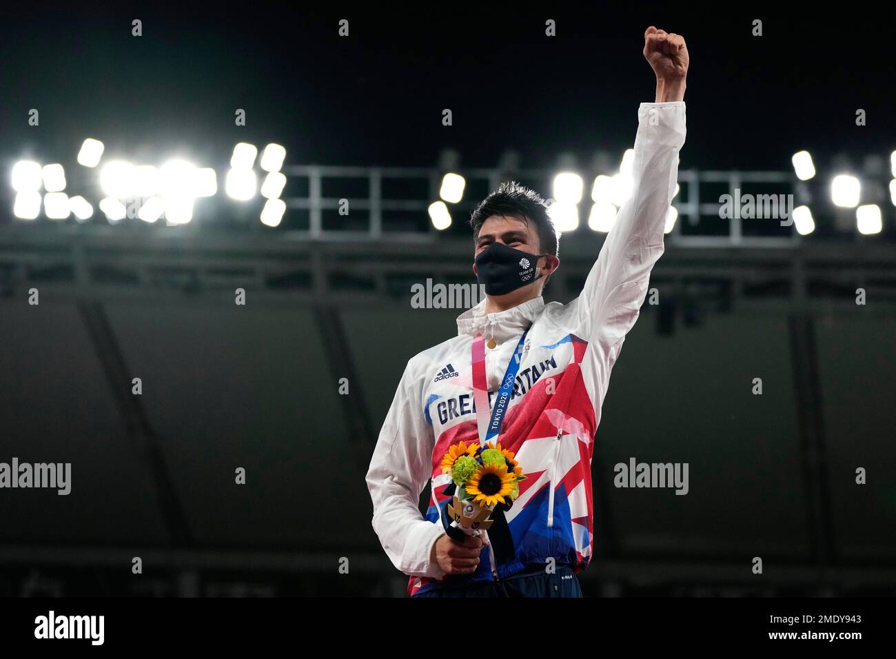Joseph Choong of Britain celebrates on the podium during the medal ...