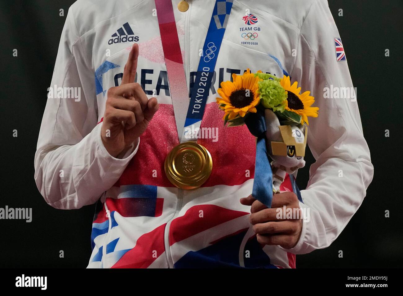 Joseph Choong of Britain celebrates on the podium during the medal ...