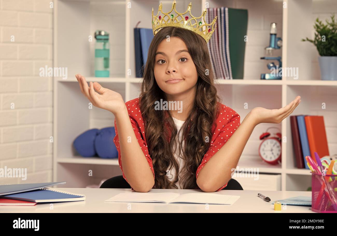 Funny face. Portrait of ambitious teenage girl with crown, feeling ...