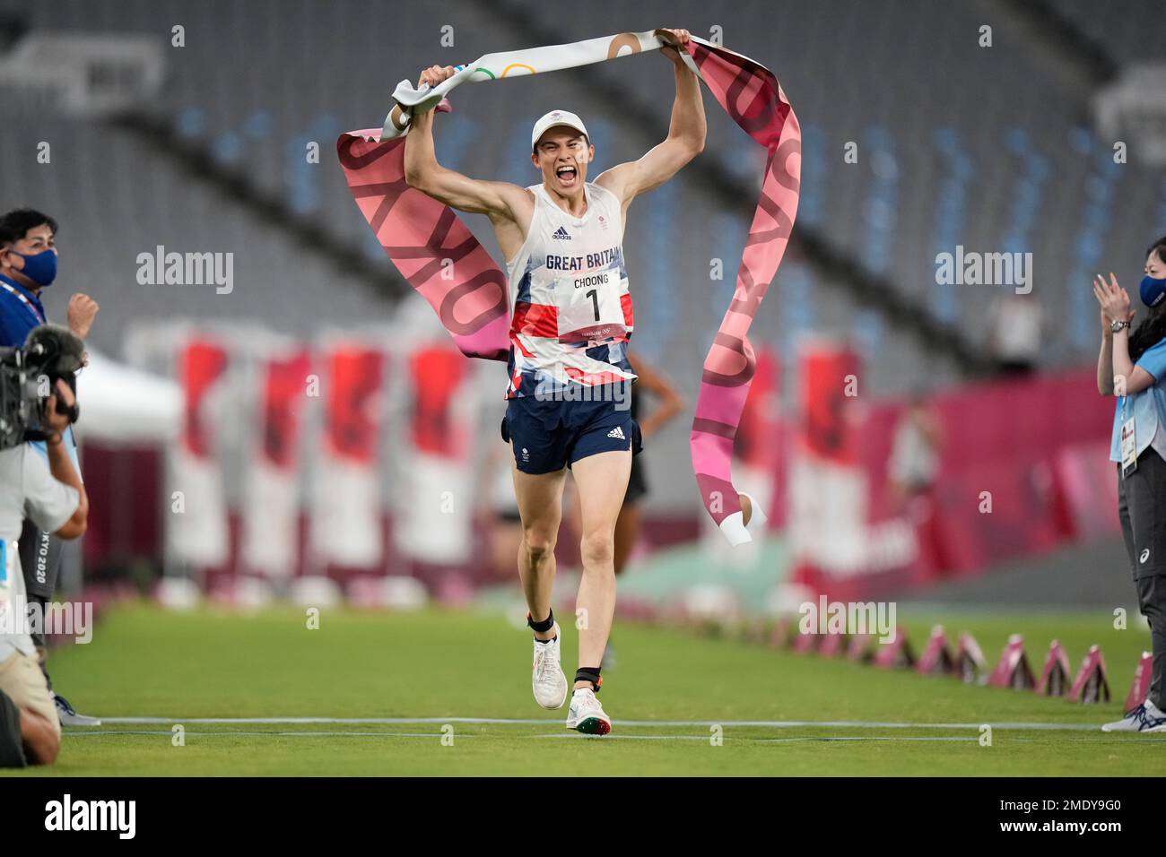 Joseph Choong of Britain crosses the finish line to win the men's ...