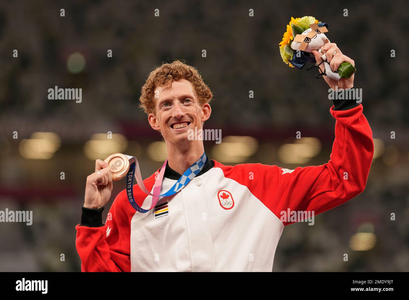 Bronze medalist Evan Dunfee, of Canada, poses during the medal ceremony ...