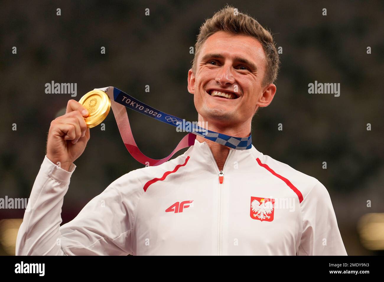 Gold medalist Dawid Tomala, of Poland, poses during the medal ceremony ...
