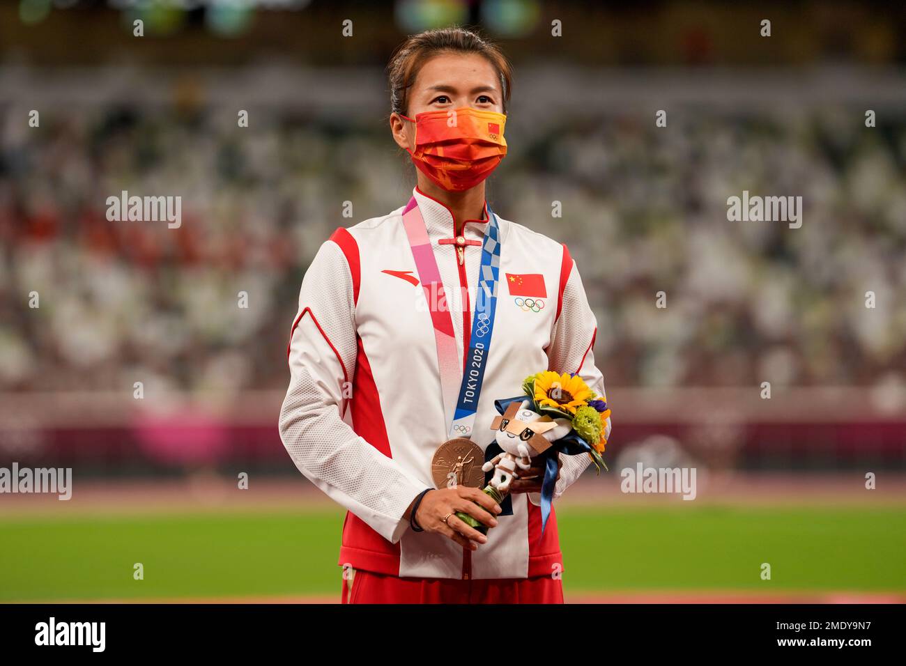 Bronze medalist Liu Hong, of China, poses during the medal ceremony for ...