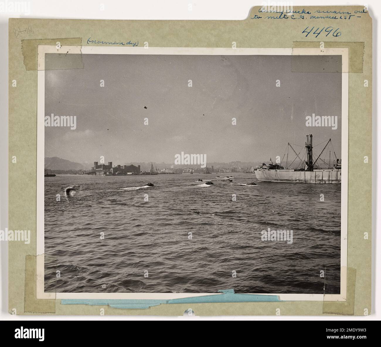 Army ducks (amphibious vehicles) meet a Coast Guard-manned LST (Landing ...