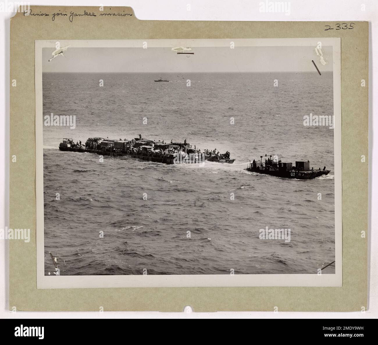 A 'Rhino' amphibious landing vehicle, heavily loaded with fighting men ...