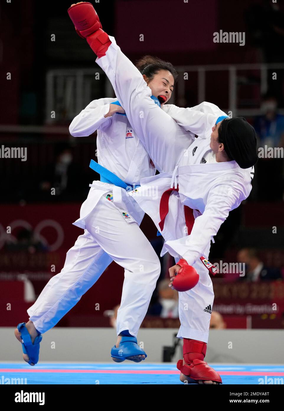Gong Li of China, left, and Hamideh Abbasali of Iran compete in the ...
