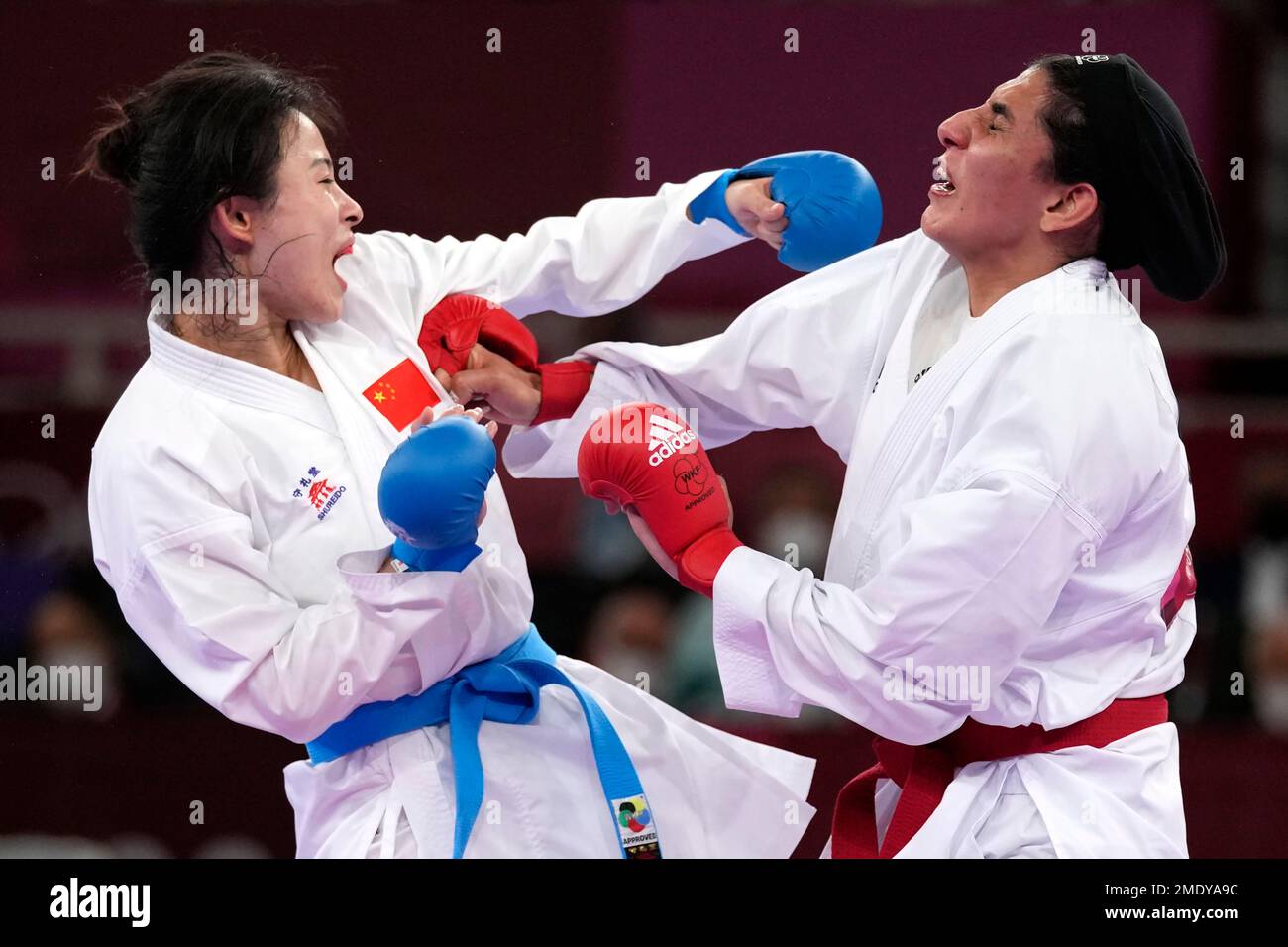Gong Li of China, left, and Hamideh Abbasali of Iran compete in the ...