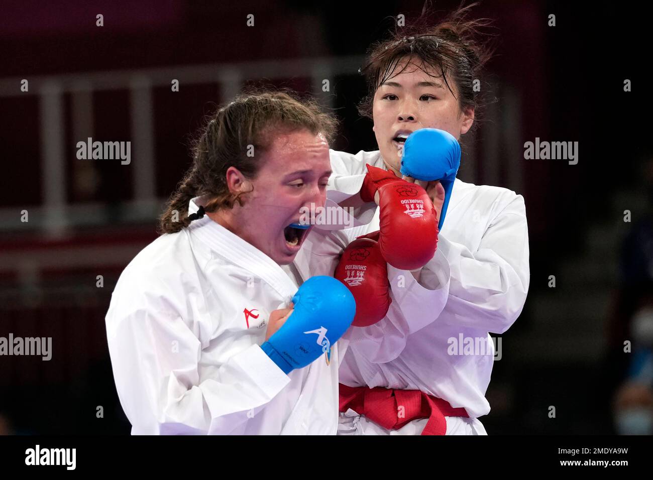 Sofya Berultseva of Kazakhstan, left, and Ayumi Uekusa of Japan compete ...
