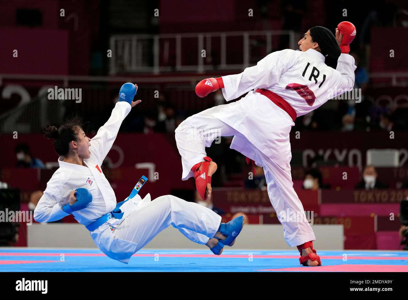 Gong Li of China, left, and Hamideh Abbasali of Iran compete in the ...