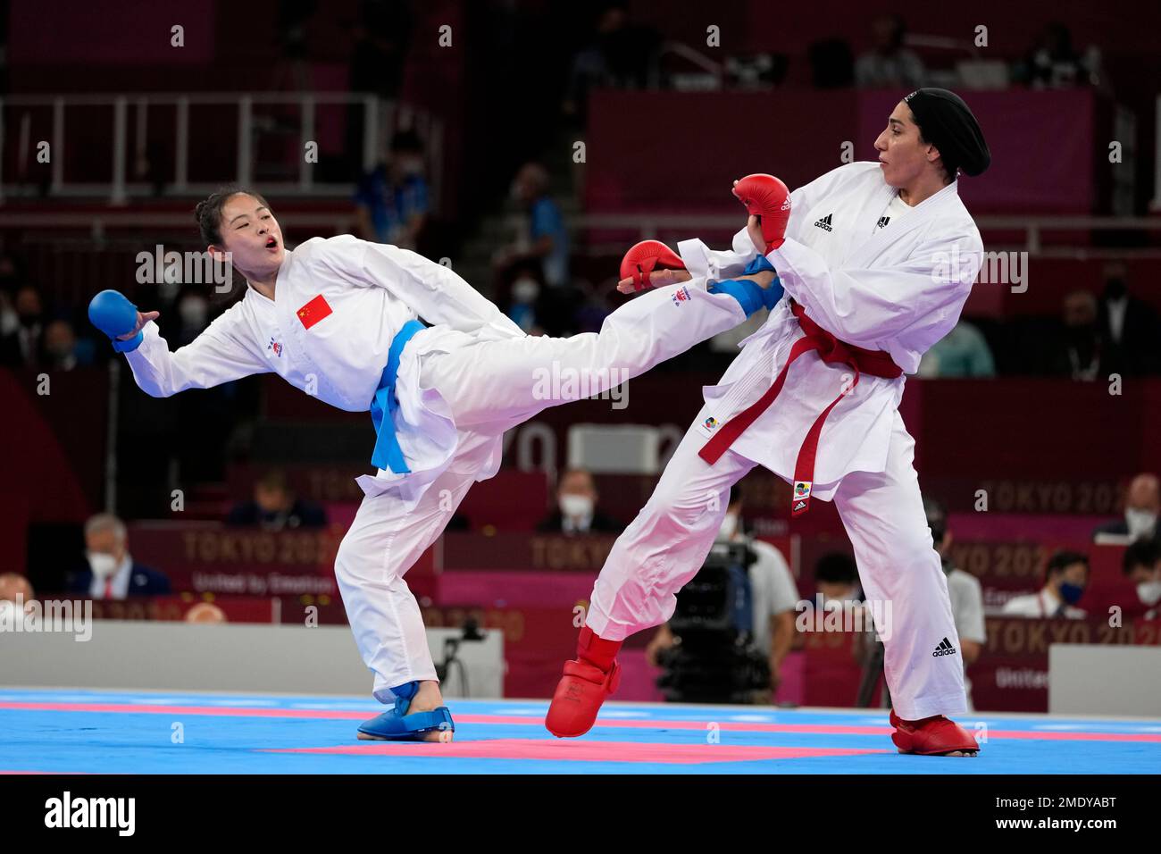 Gong Li of China, left, and Hamideh Abbasali of Iran compete in the ...