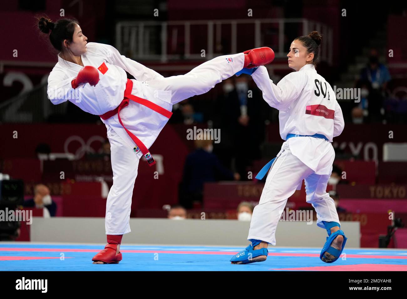 Gong Li of China, left, and Elena Quirici of Switzerland compete in the ...