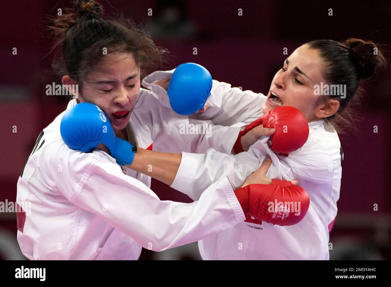 Gong Li of China, left, and Elena Quirici of Switzerland compete in the ...