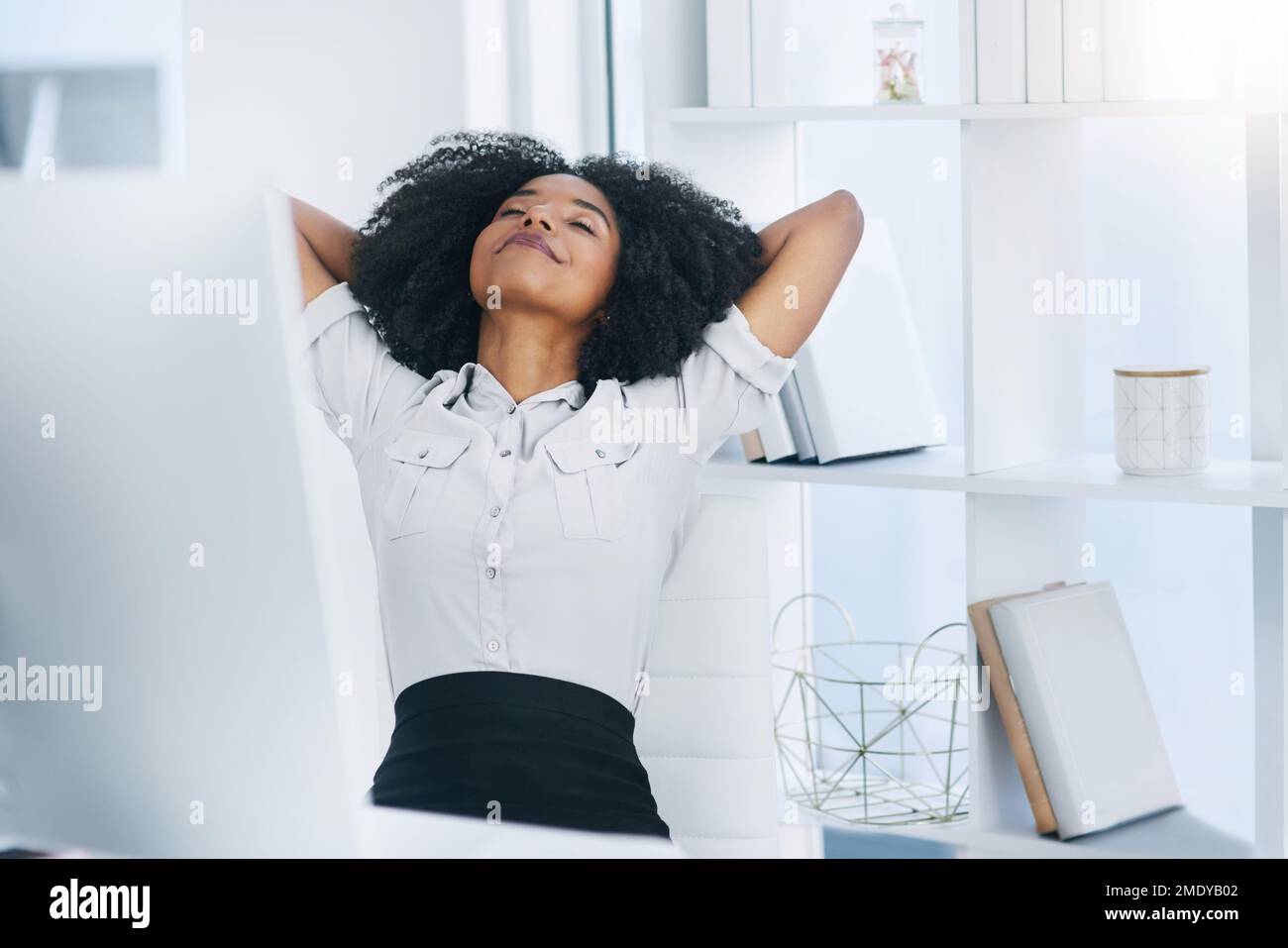 Hard work always pays off. a young businesswoman taking a break at her ...