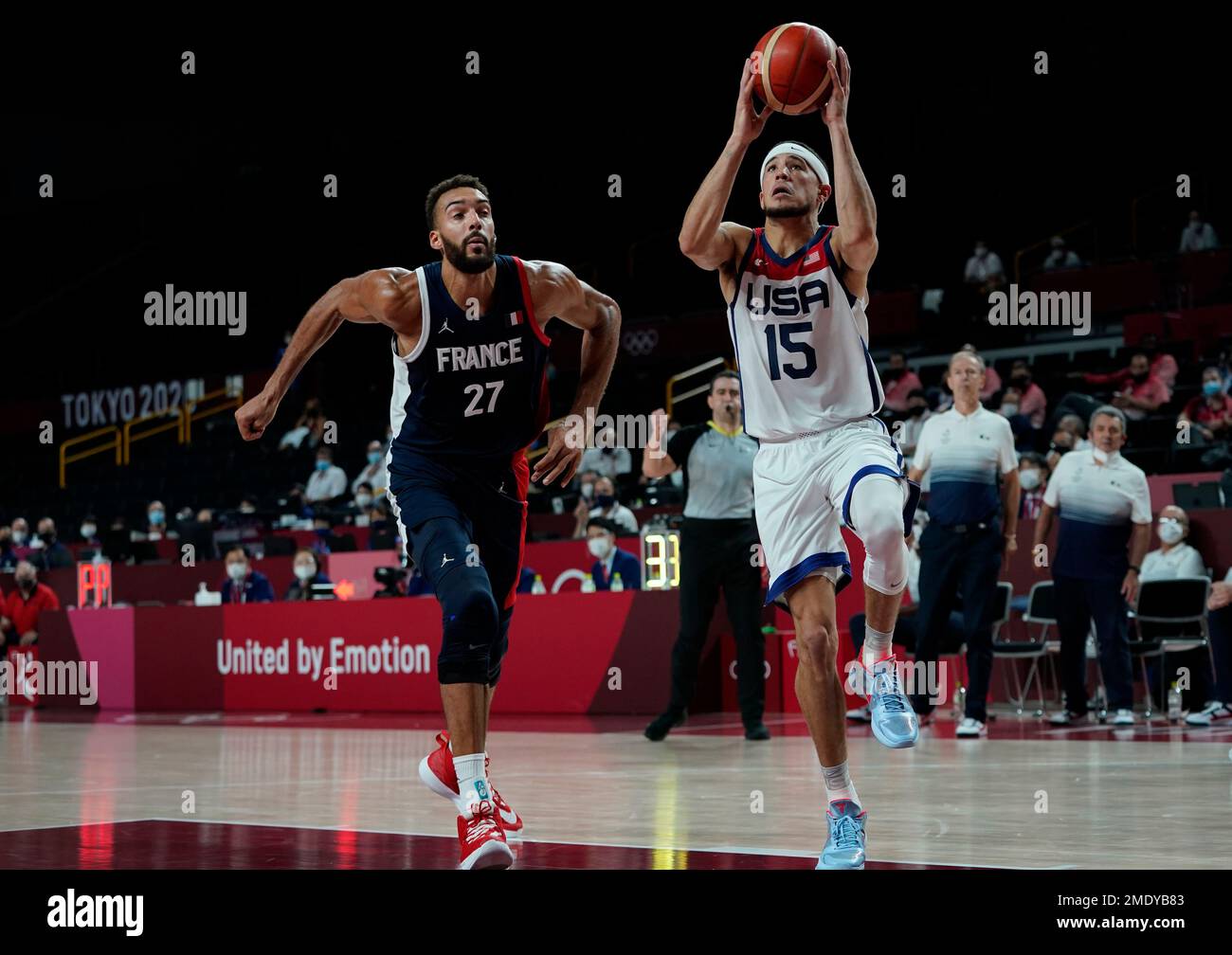 United States' Devin Booker (15) drives to the basket ahead of France's ...