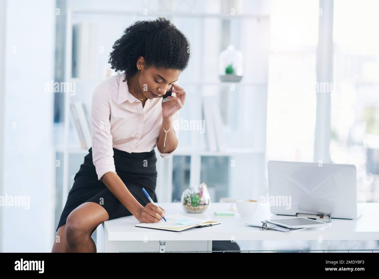 Let me look at my schedule and get back to you. a young businesswoman ...