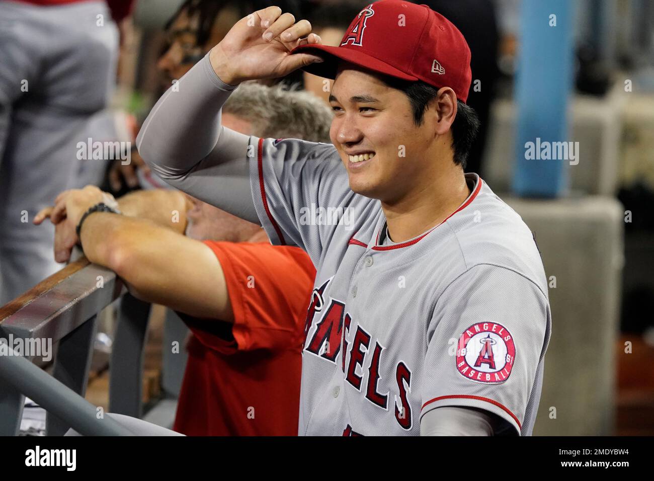 Los Angeles Angels' Shohei Ohtani smiles in the dugout during the fifth ...
