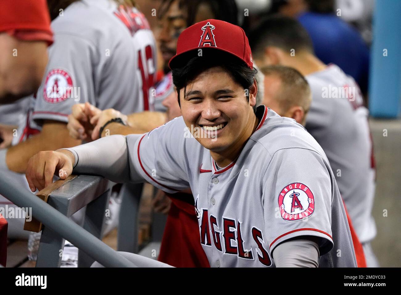 Los Angeles Angels' Shohei Ohtani smiles in the dugout during the fifth ...