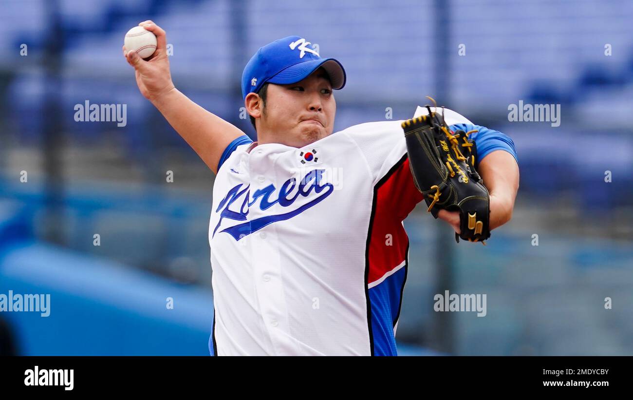 South Korea's Minwoo Kim pitches during the the first inning of the bronze medal baseball game ...