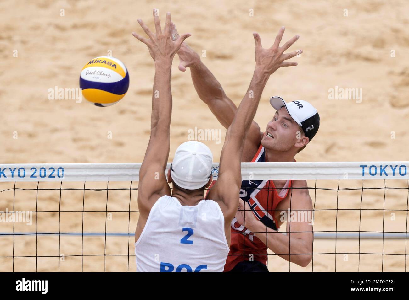 Christian Sandlie Sorum, right, of Norway, takes a shot as Oleg ...