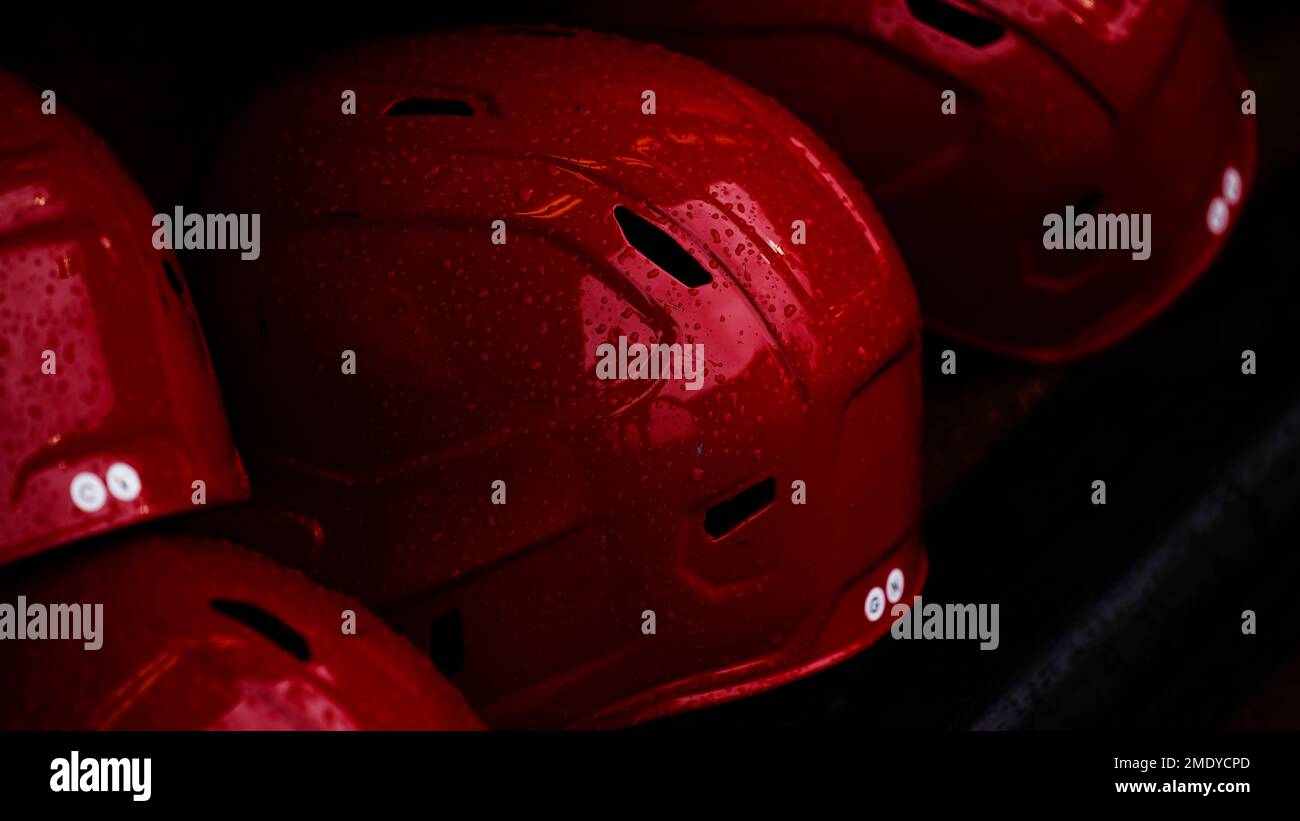 Raindrops collects on helmets ahead of a bronze medal baseball game ...