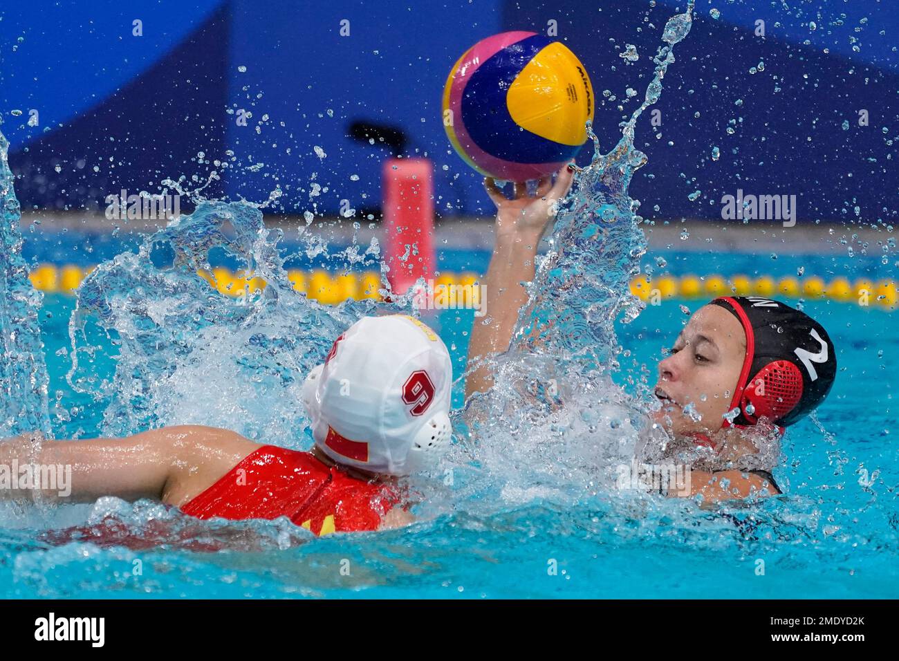 Canada's Kelly McKee (2) is defended by China's Deng Zewen (9) during a ...