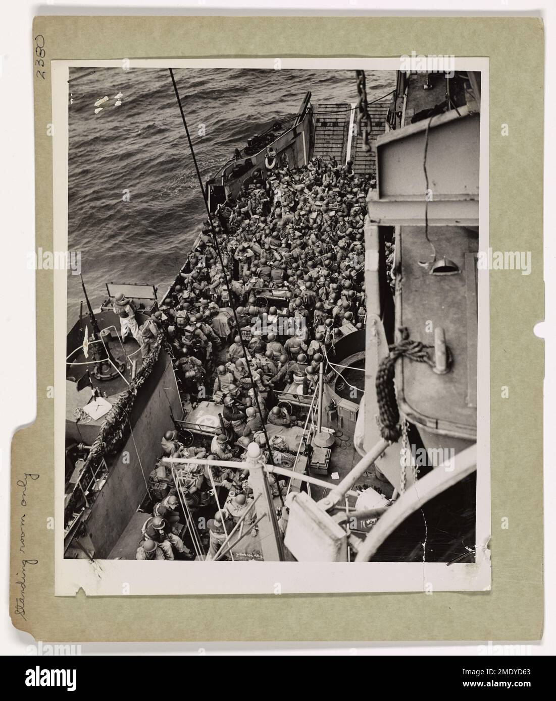 An LCT (Landing Craft, Tank) is loaded with American troops and ...