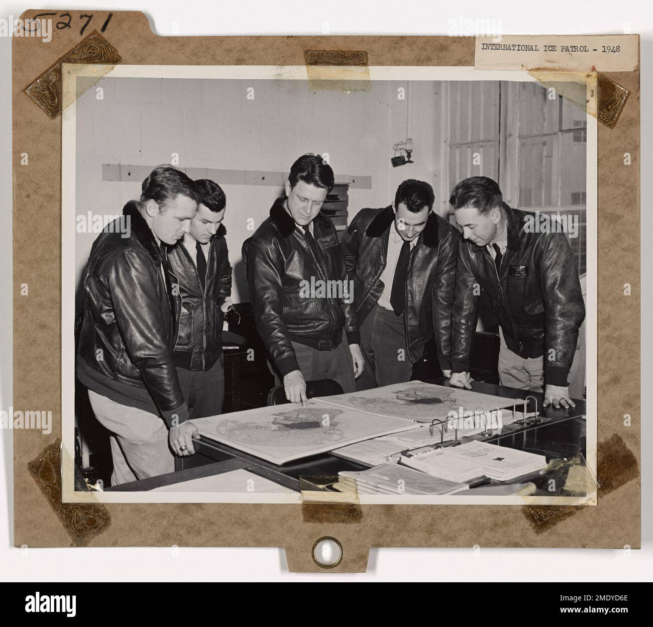 A senior Coast Guard Ice Patrol pilot briefs his team before an Ice ...