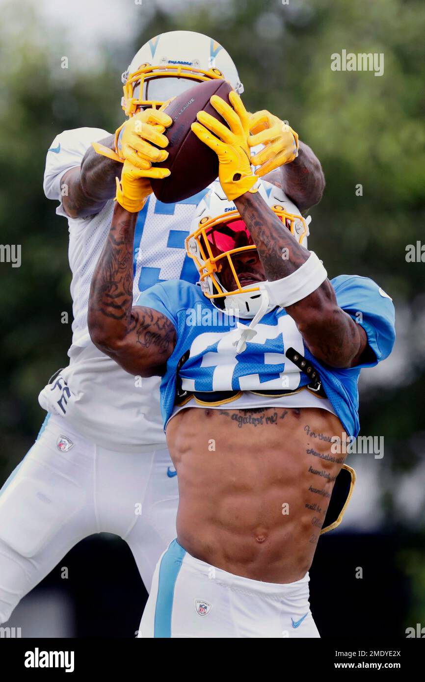 Los Angeles Chargers free safety Derwin James, right, intercepts a pass ...