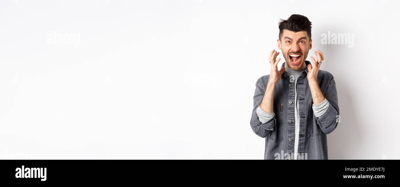 Angry man screaming distressed, losing temper and shouting frustrated ...