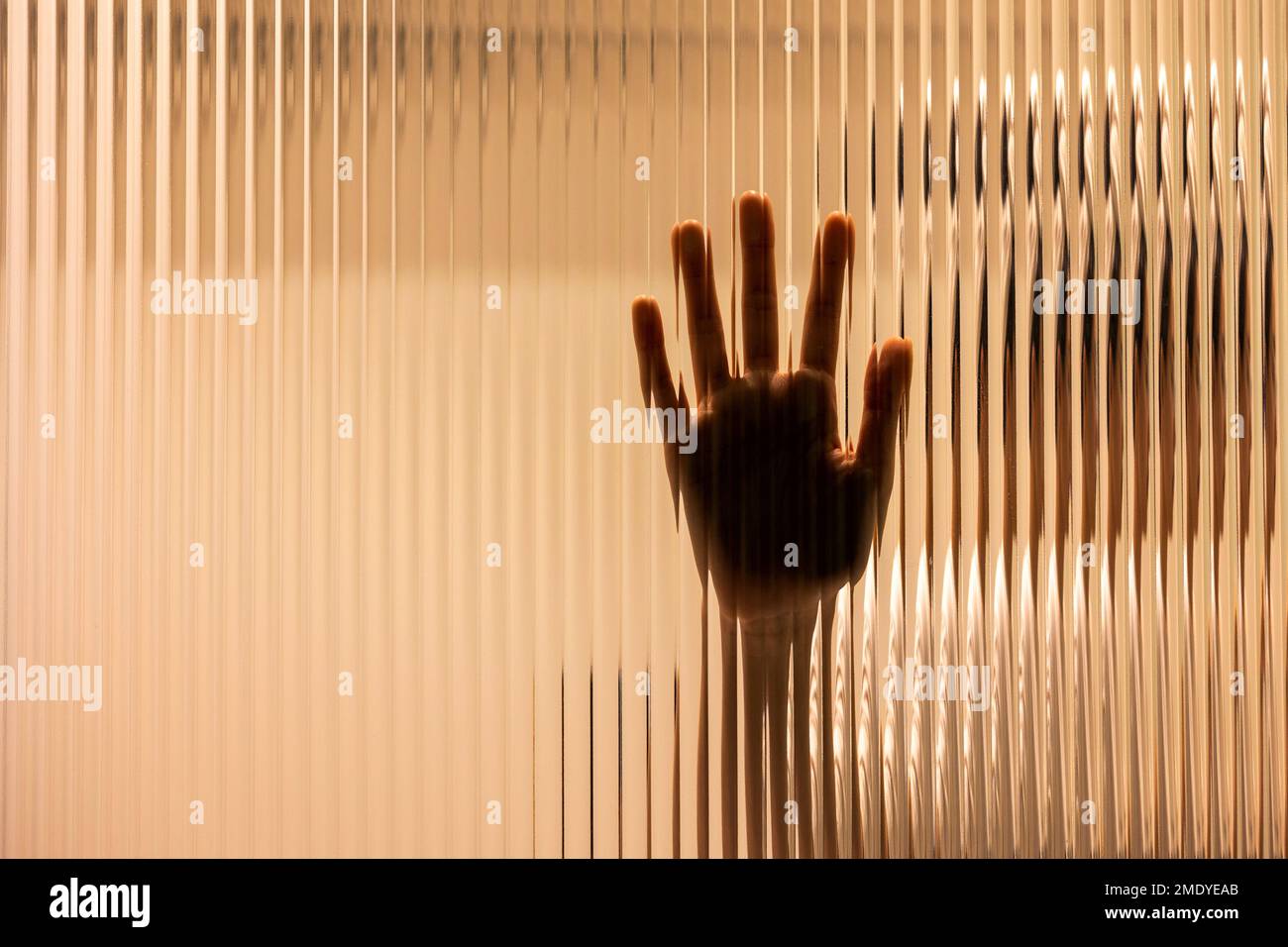 One hand on the textured glass Stock Photo - Alamy